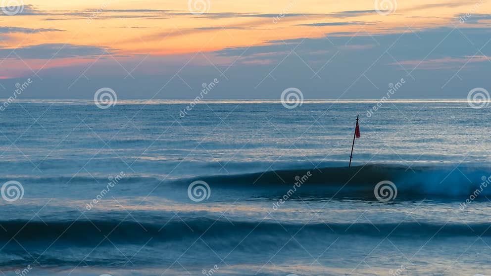 Two waves and a red flag stock photo. Image of minimalism - 122746362