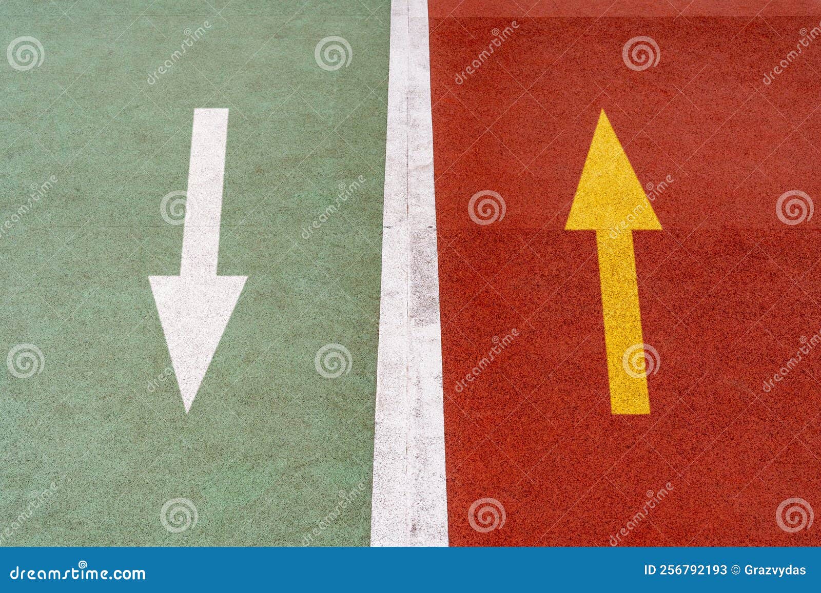 A Two Way Arrows Pointing in Opposite Directions Symbol on a Road ...