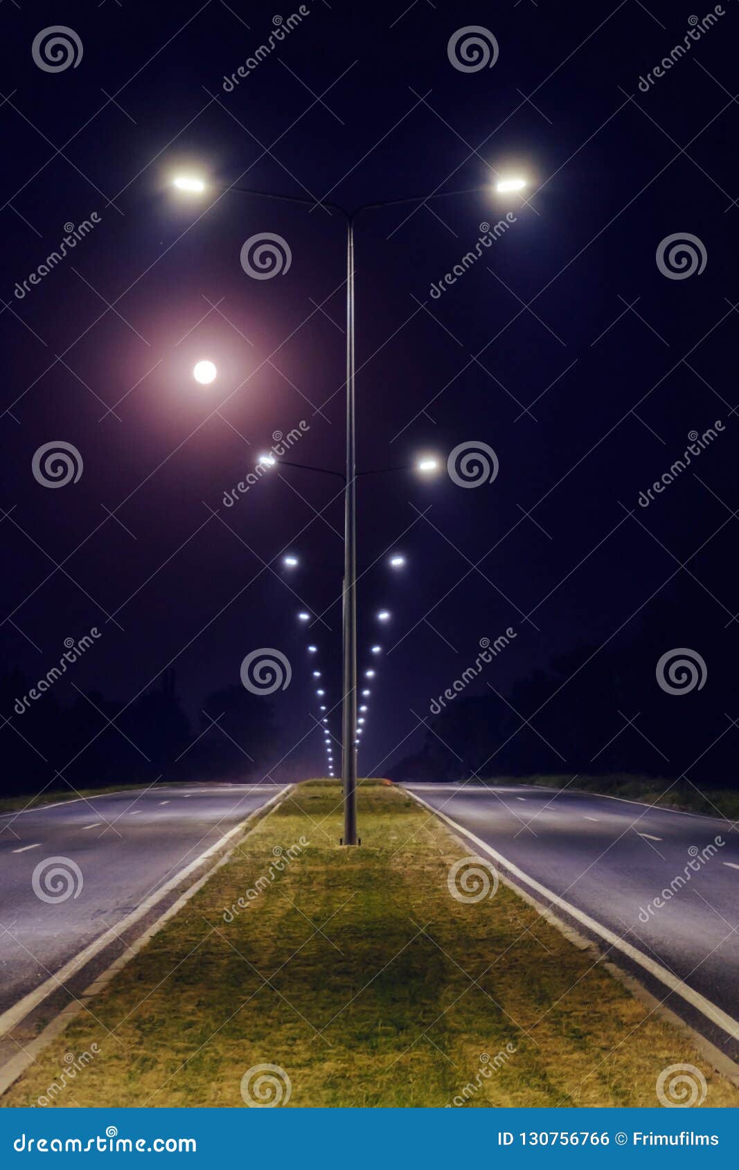 A Two-way Road is Illuminated by the Light Post Stock Photo - Image of ...