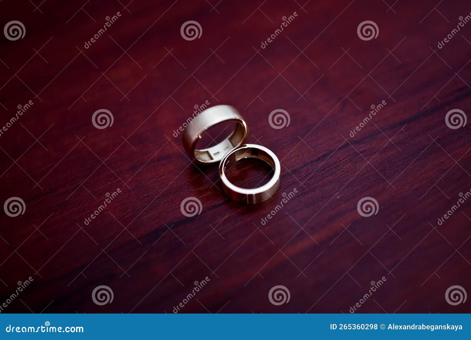Two Gold Wedding Rings are Lying on a Wooden Table Stock Photo - Image ...