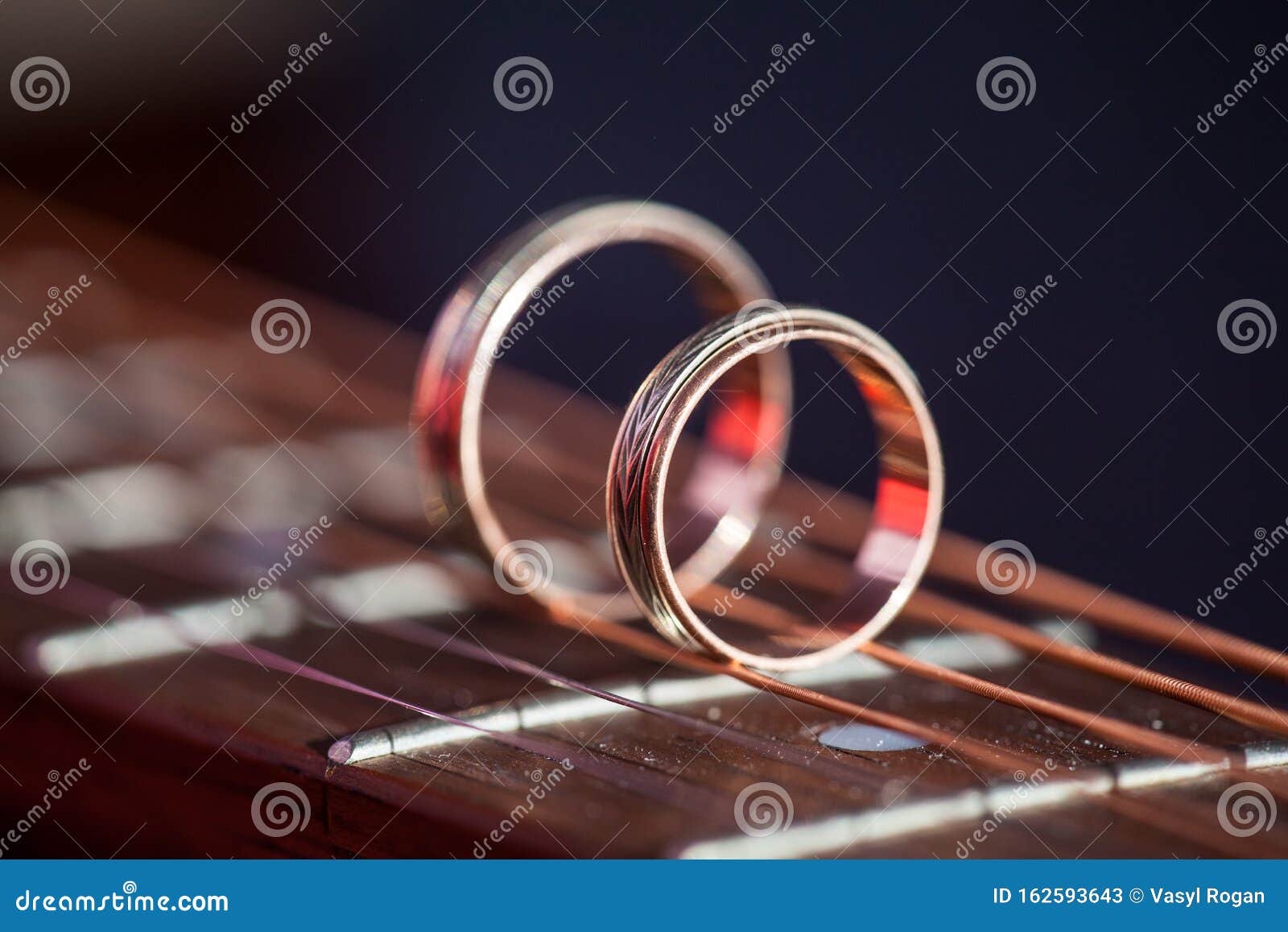 Two Wedding Rings on Guitar Strings. Shallow Depth of Field Stock Image ...