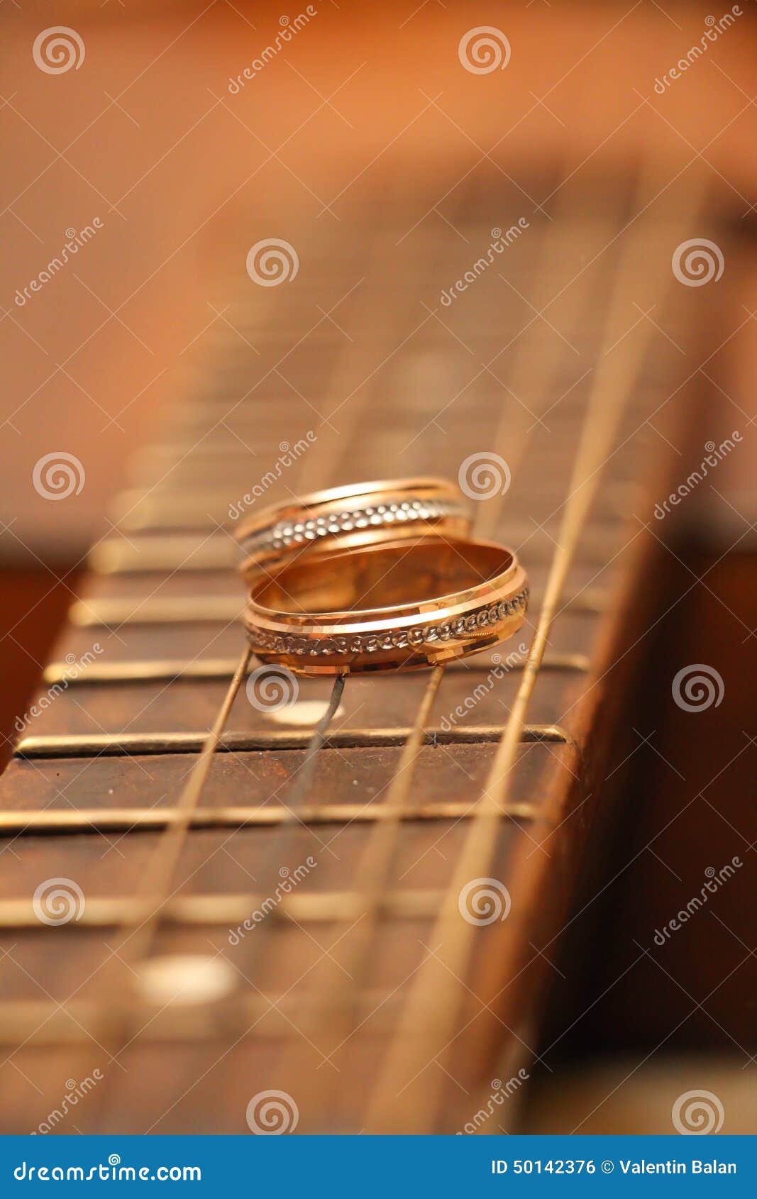 Two Wedding Rings are on Guitar Stripes Stock Photo - Image of room ...