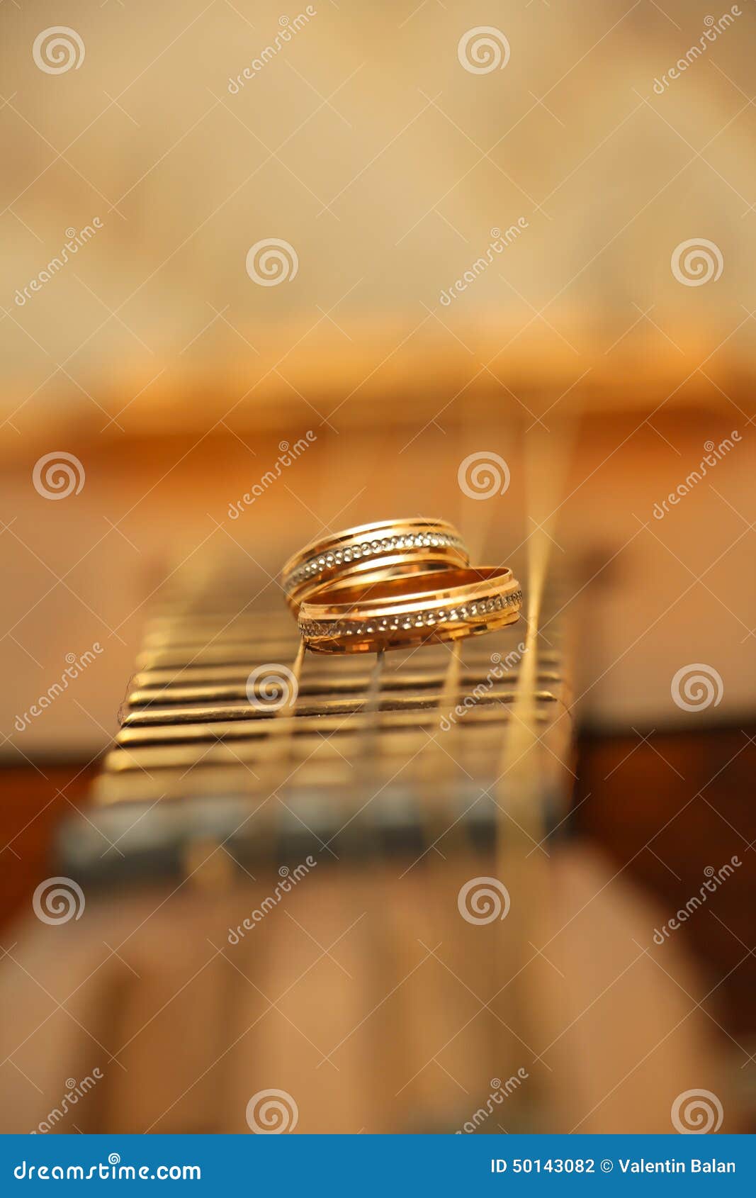 Two Wedding Rings are on Guitar Stripes Stock Photo - Image of straight ...