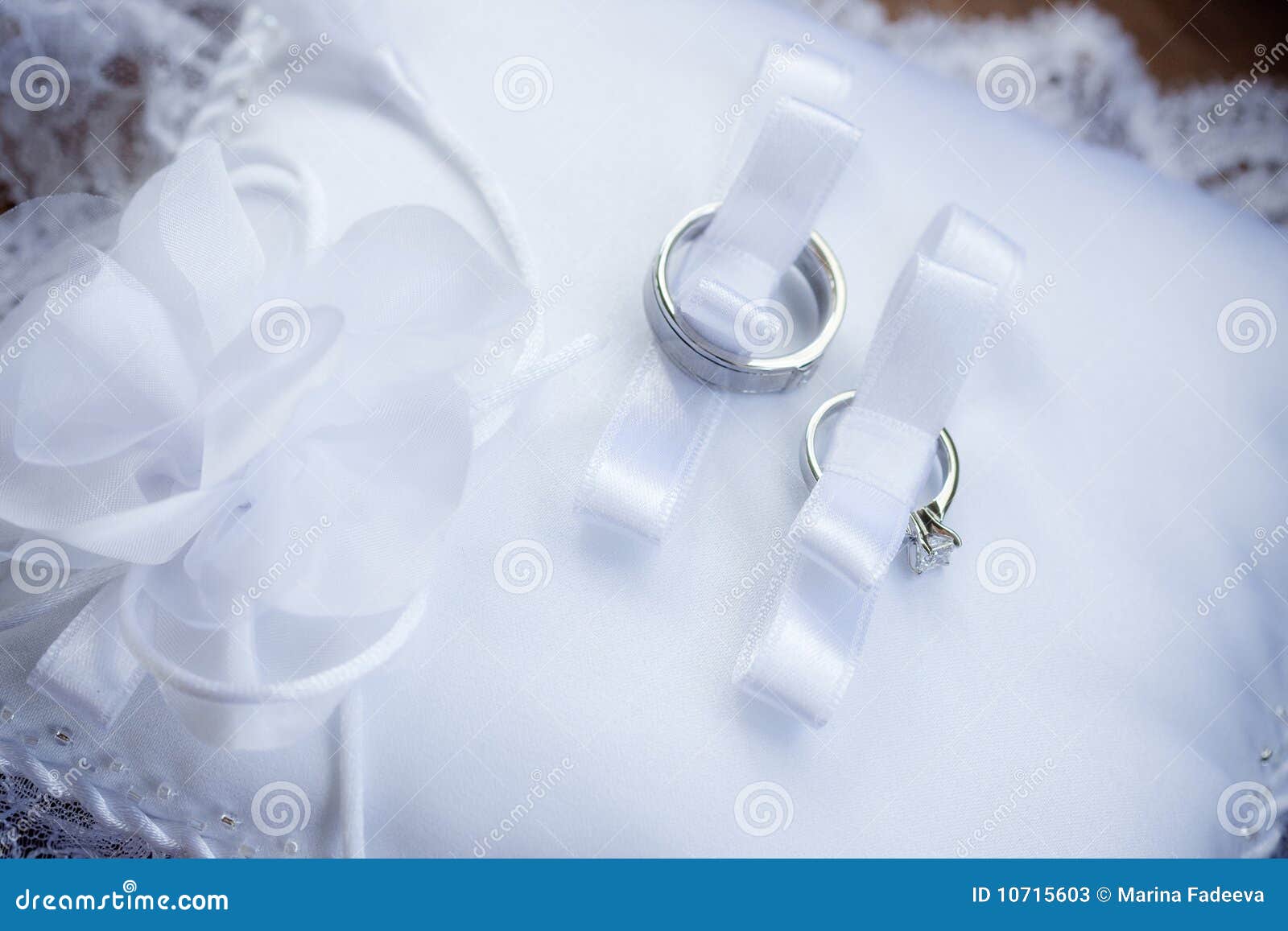 Two Wedding Rings in Ribbon on Pillow Stock Image - Image of golden ...