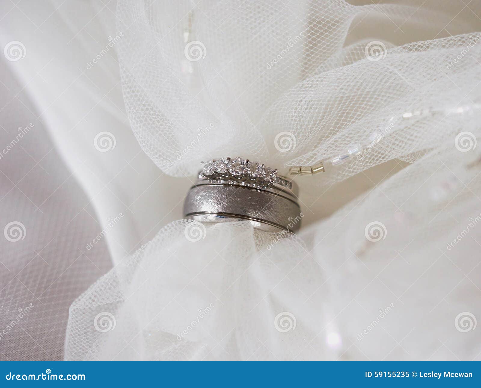Two Wedding Rings with Veil Treaded through Stock Image - Image of ...