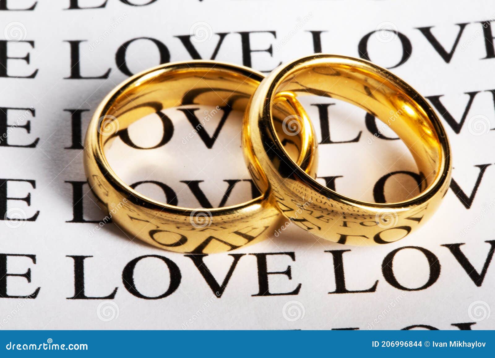 Two Wedding Rings and Word Love Stock Photo - Image of coupled, ring ...