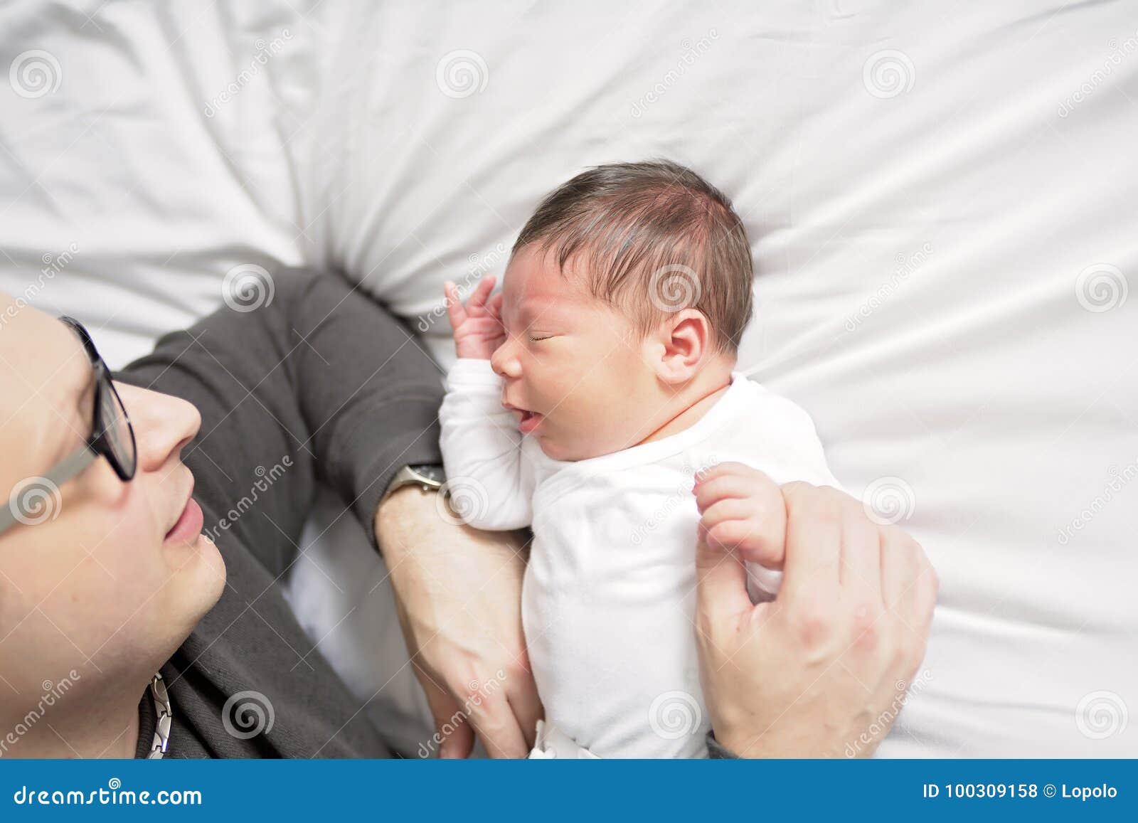 Two Week Newborn Baby with Father in Bed Stock Photo - Image of baby ...