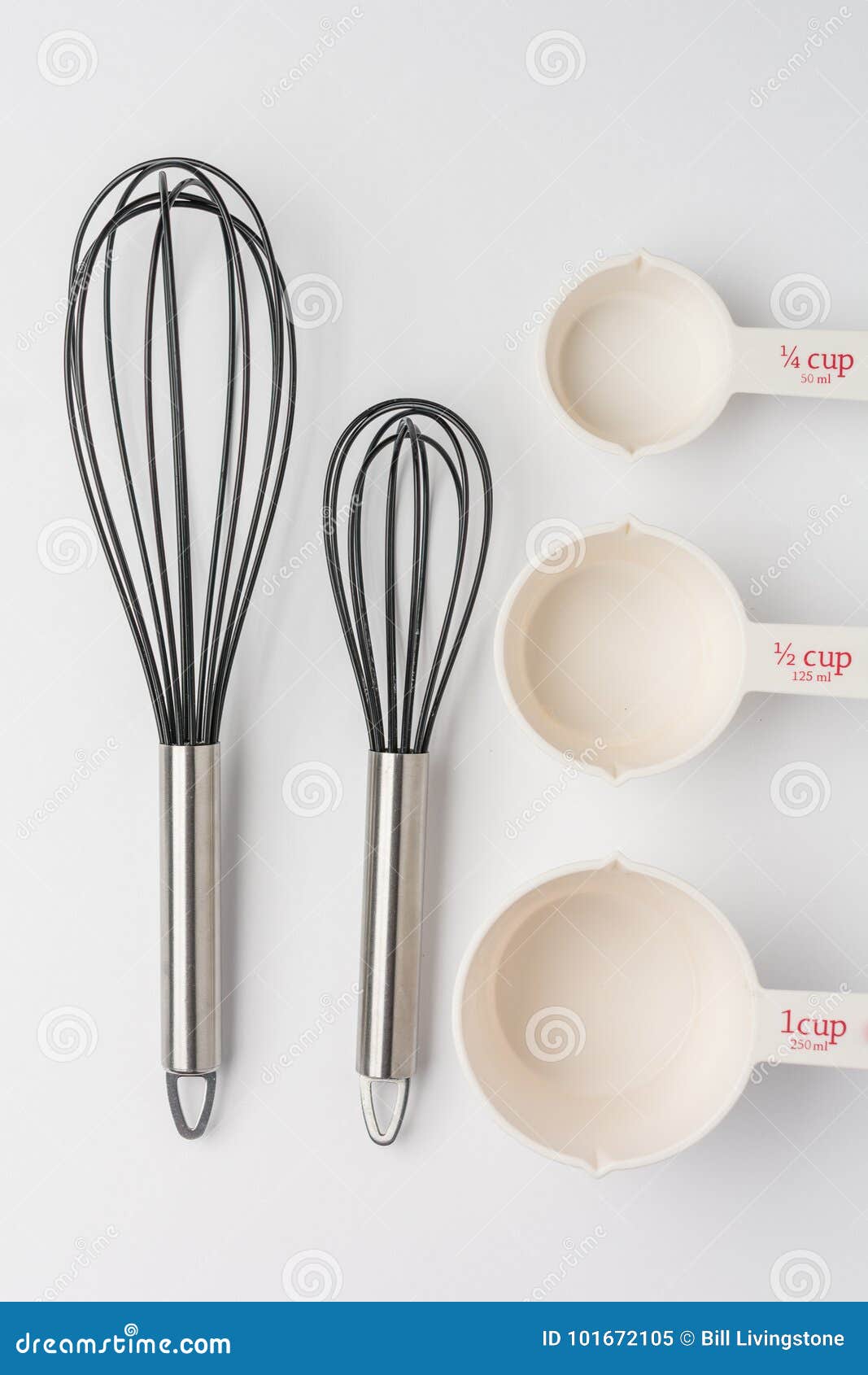 Two Whisks with Measuring Cups on White Background Top View Stock Image ...