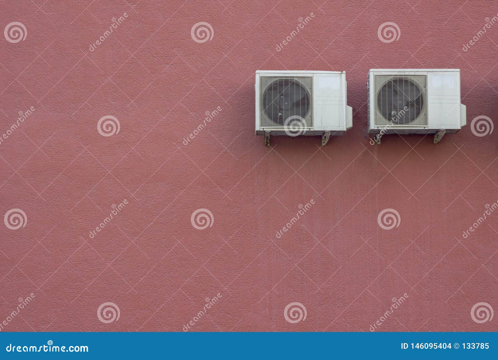 Two White Air Conditioner Radiators On A Red Granular Concrete Wall ...