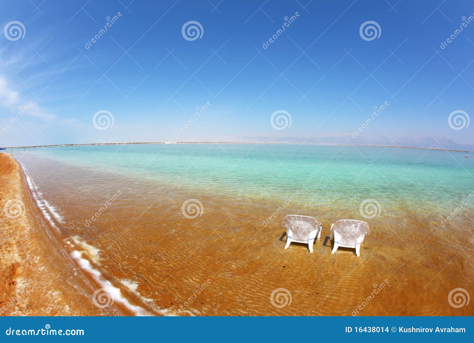 Two White Beach Chairs Stood in the Water Stock Photo - Image of ...