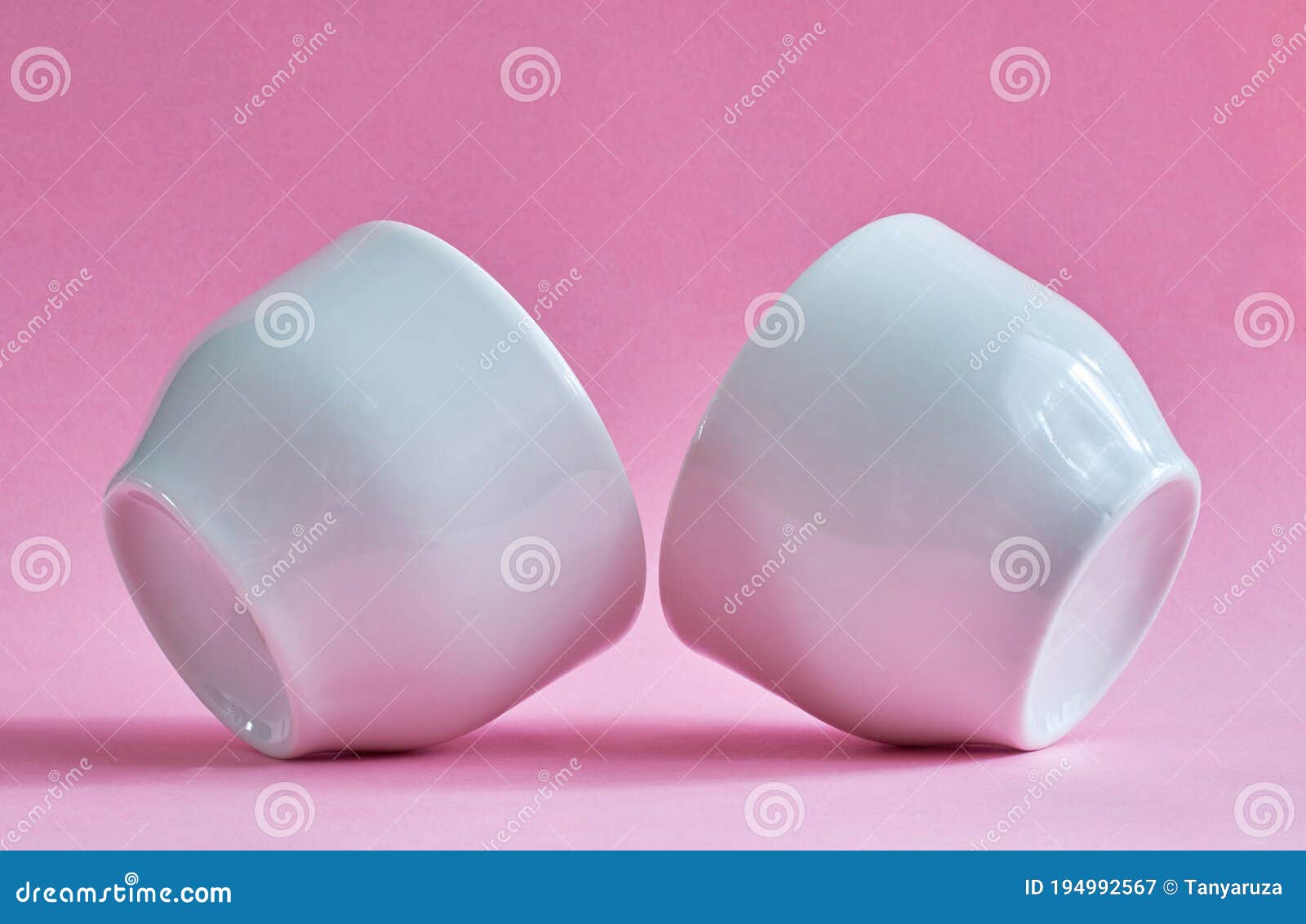 Two White Ceramic Cups without Handles on Pink Background Stock Image ...