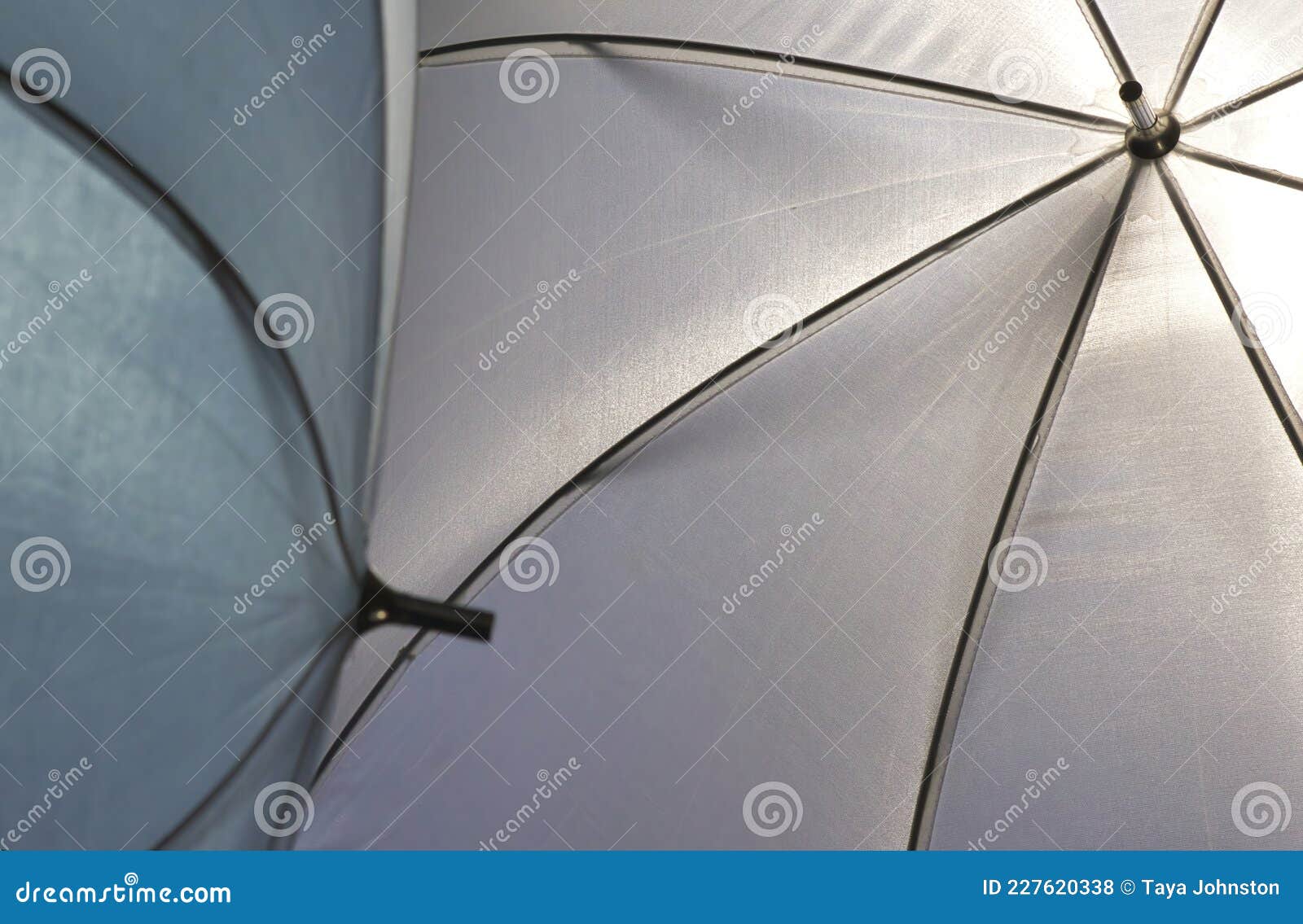 Two White Clothe Umbrellas with Black Wire Frames Stock Photo - Image ...