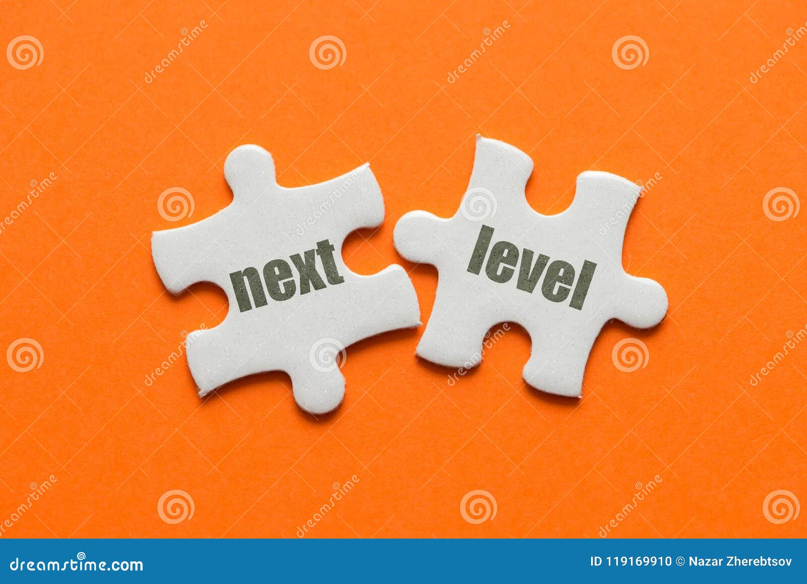 Two White Details of Puzzle with Text Next Level on Orange Background ...