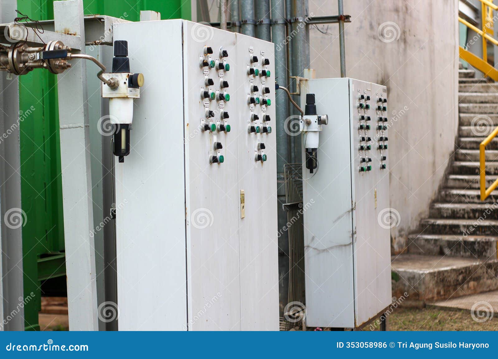 Two White Electrical Control Panels with Green Buttons and Black Knobs ...