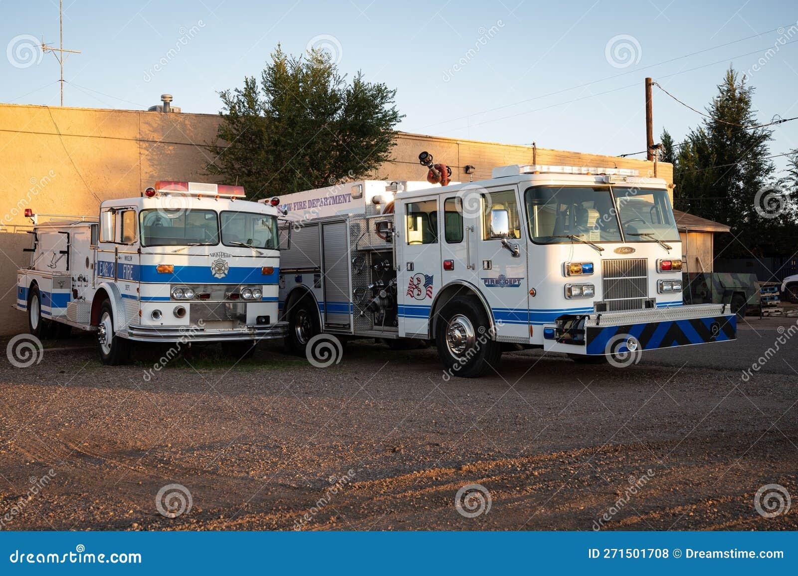 White Fire Trucks are Parked Next To Each Other in a Parking Lot ...