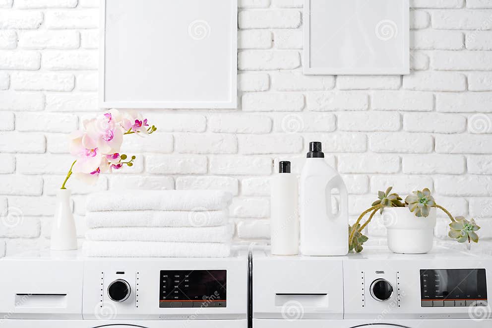 Two White Front Loading Washing Machines in Modern Laundry Room Stock ...