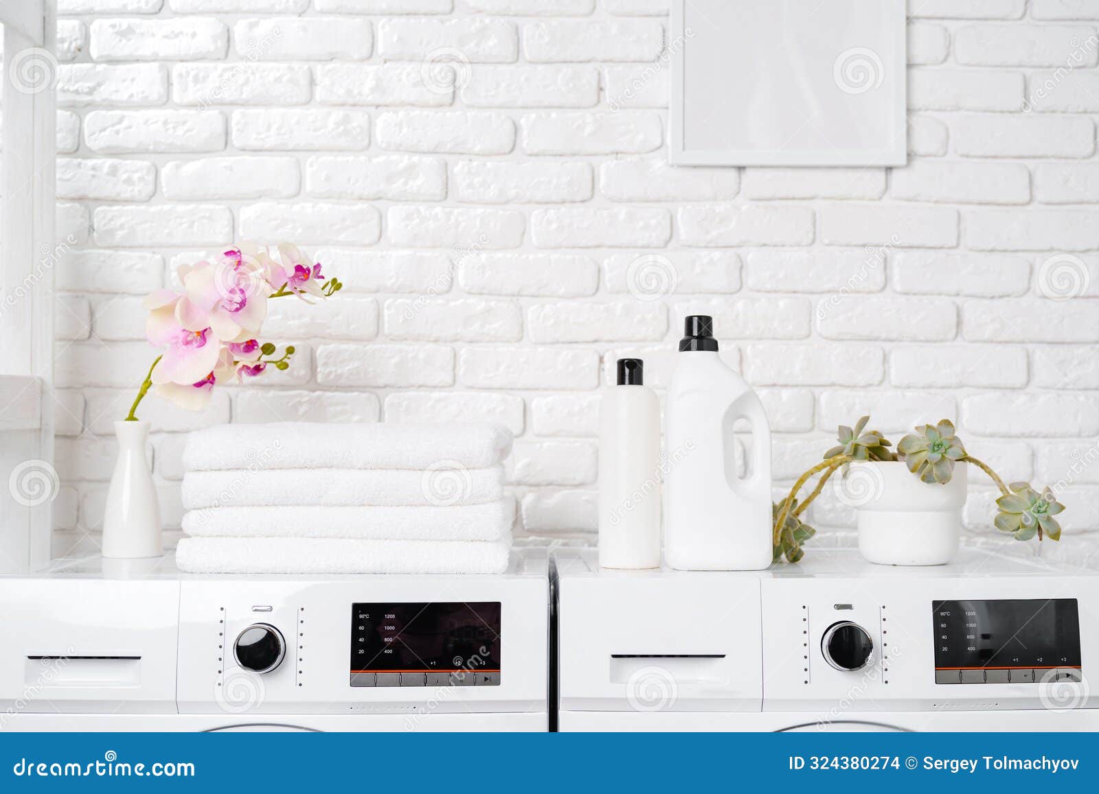 Two White Front Loading Washing Machines in Modern Laundry Room Stock ...