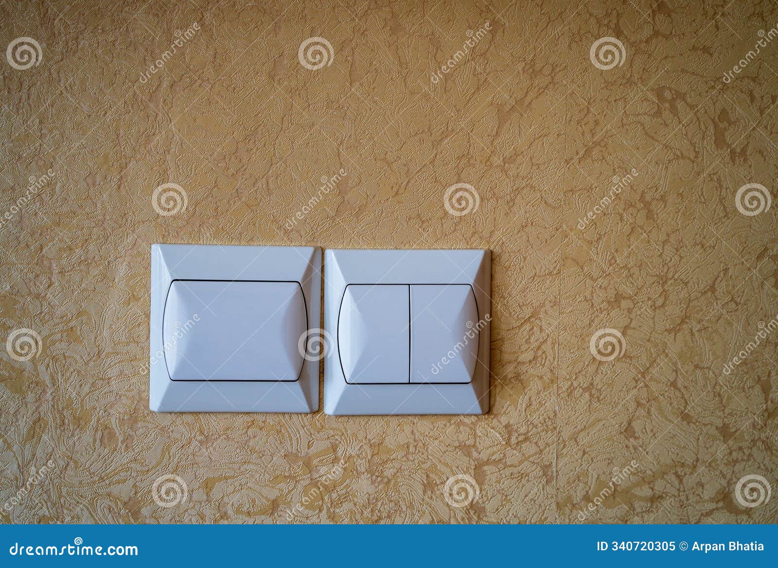 Two White Light Switches Mounted on a Textured Beige Wall Stock Image ...