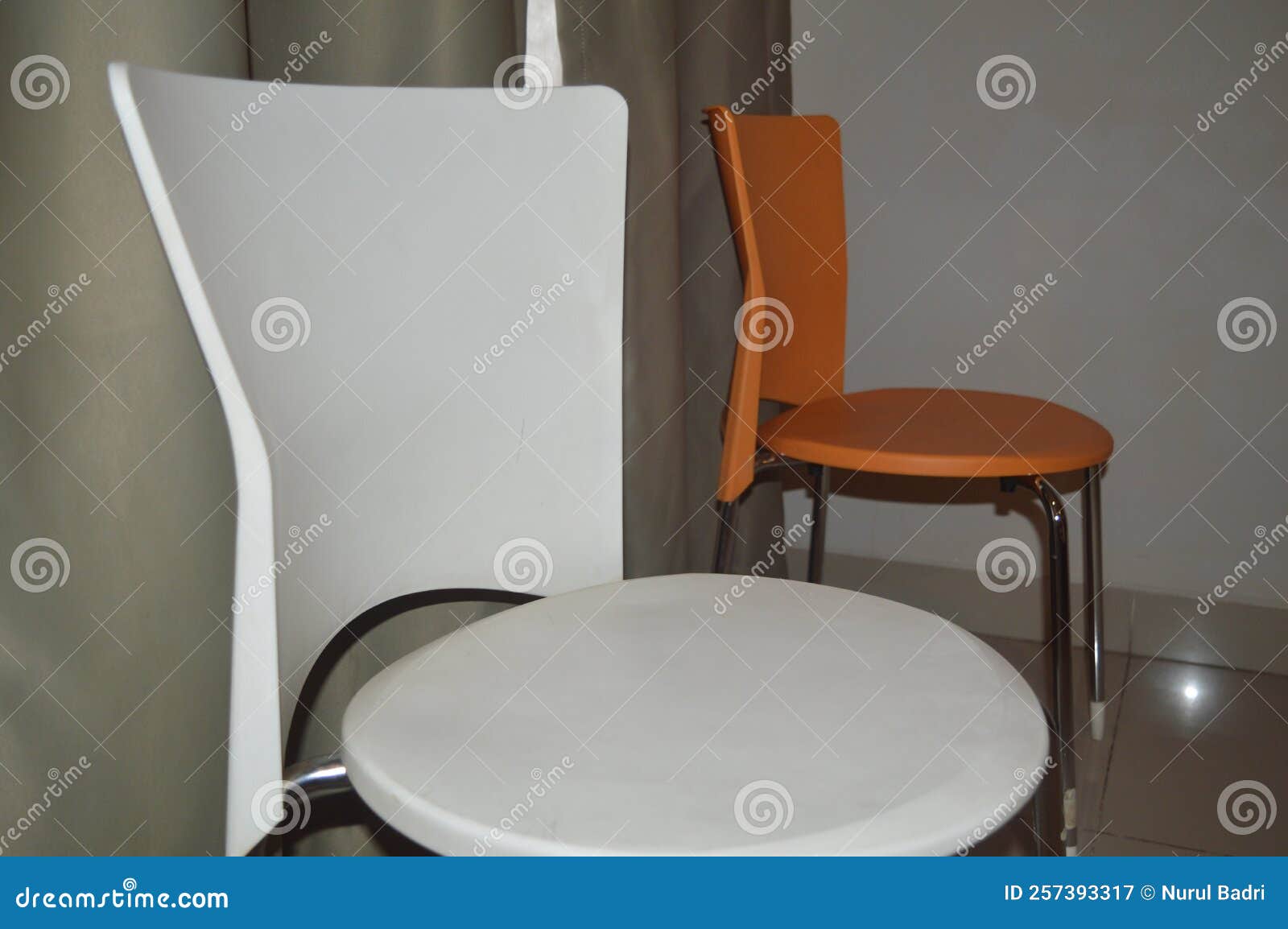Two White and Orange Plastic Chairs in a Hotel Room Stock Image - Image ...