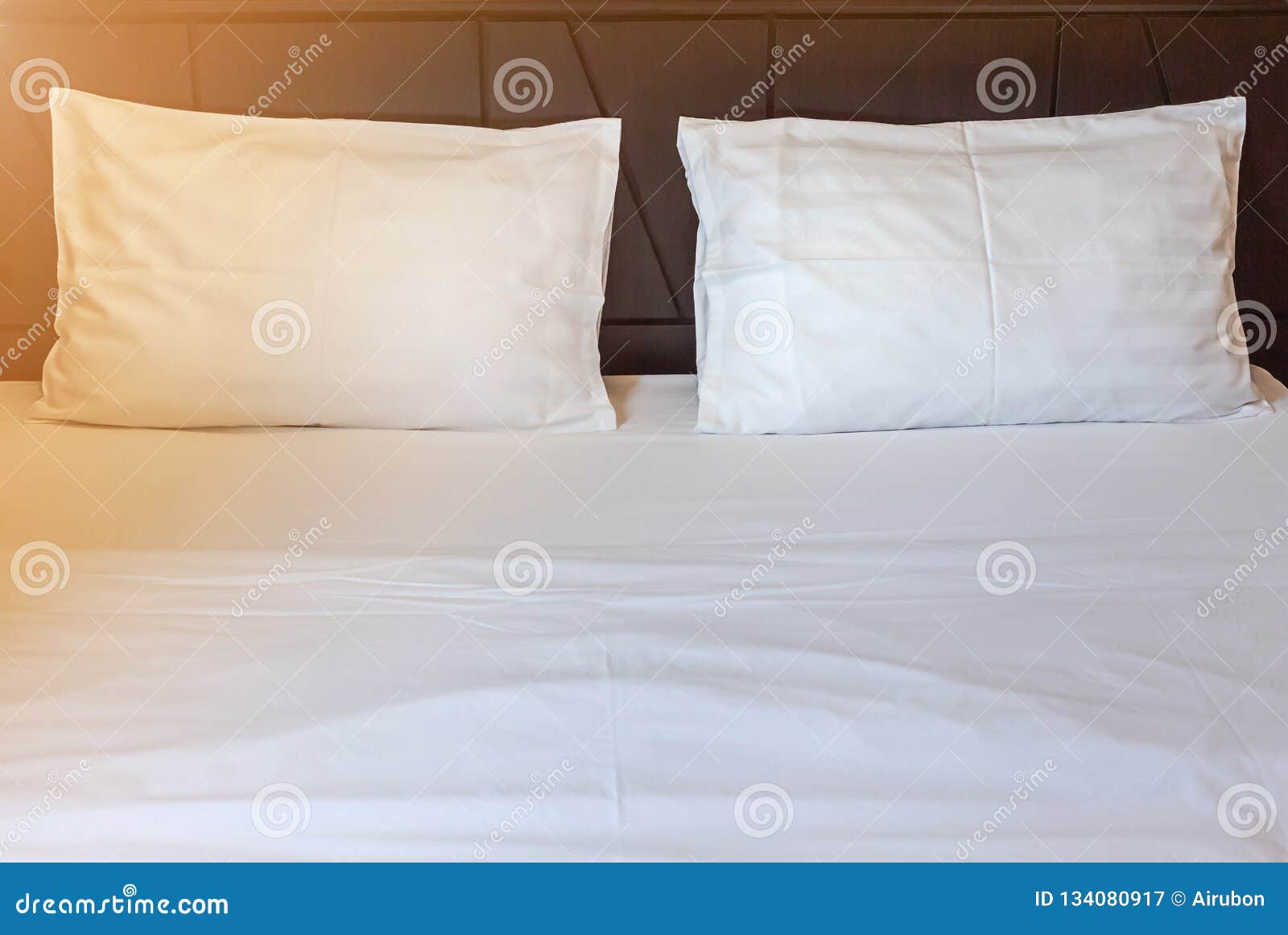 Two White Pillows with White Bedding Sheet on Empty Bed in Bedroom ...