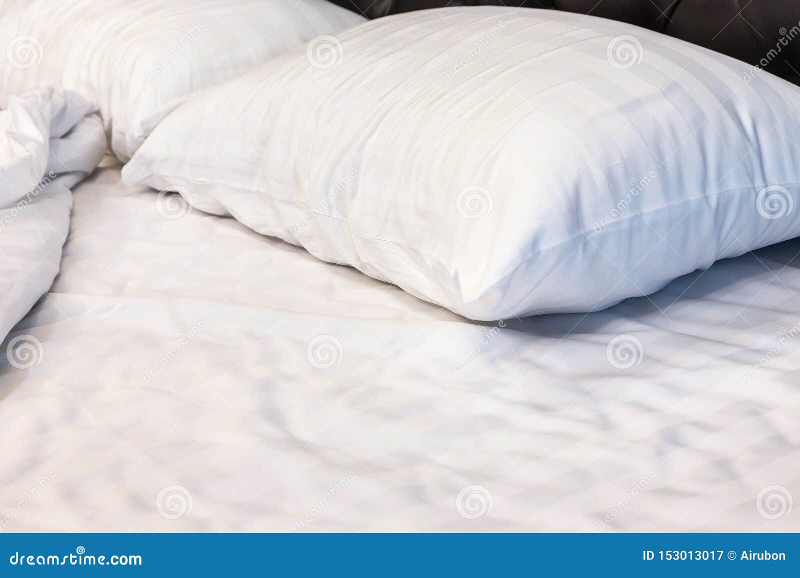Two White Pillows with White Bedding Sheet on Empty Bed in Bedroom ...