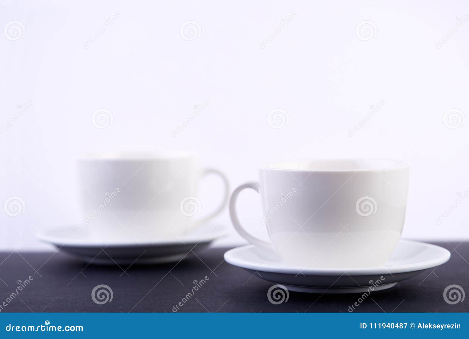 Two White Porcelain Teacups on Black Table Show Clean and Simple Design ...