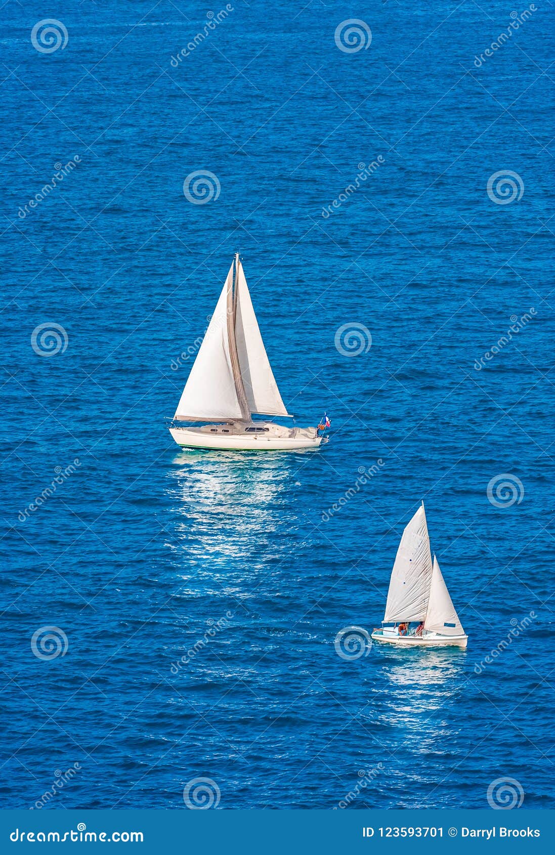 Two White Sailboats on Blue Stock Image - Image of vessel, harbour ...