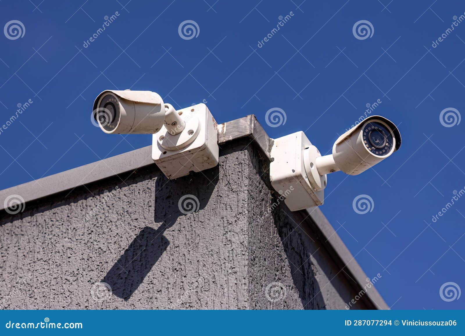 Two white security cameras stock photo. Image of private - 287077294