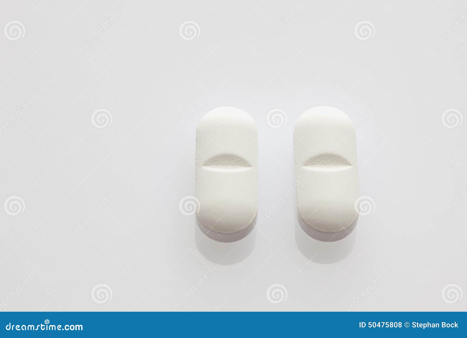Two white tablets stock photo. Image of antibiotics, medicine - 50475808
