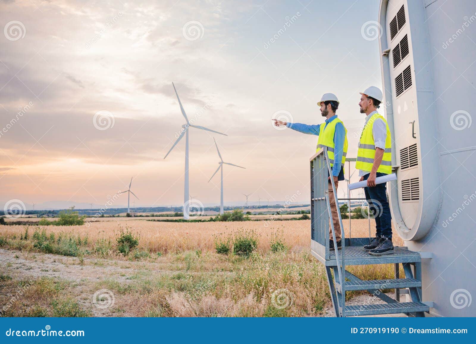 Two Wind Mill Engineers or Technicians Planning a Construction ...