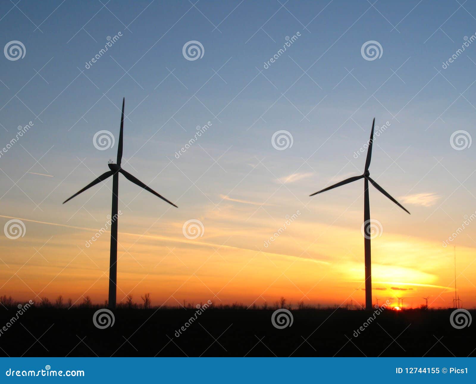 Two wind wheels stock image. Image of blue, twilight - 12744155