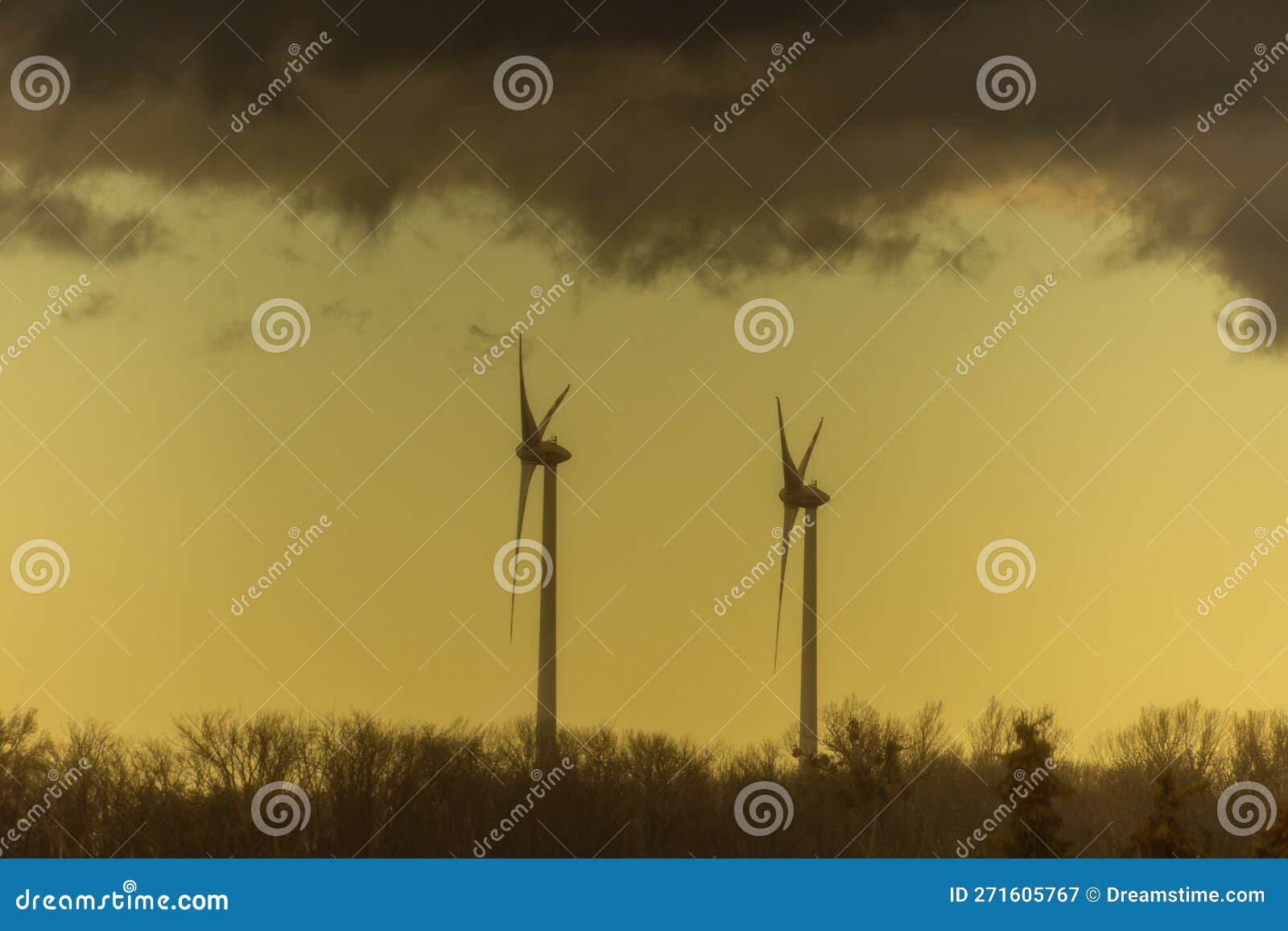 Two Windmills in a Flat Landscape with Dark Rainclouds and Yellow Color ...