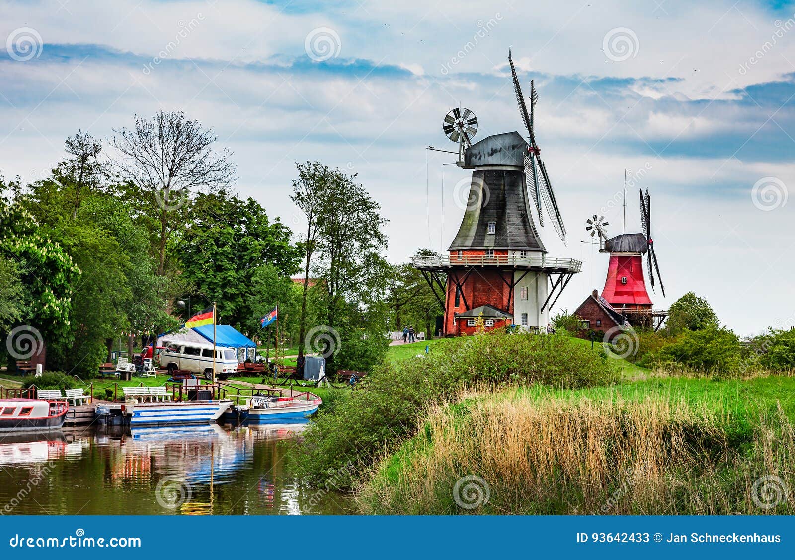 Two windmills in Greetsiel editorial stock photo. Image of historic ...