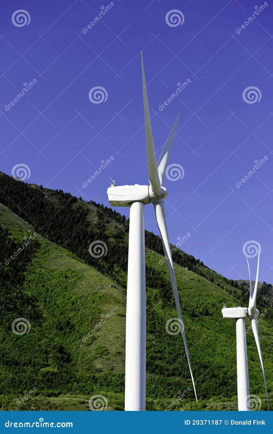 Two Windmills or Wind Turbines Stock Image - Image of hills, field ...