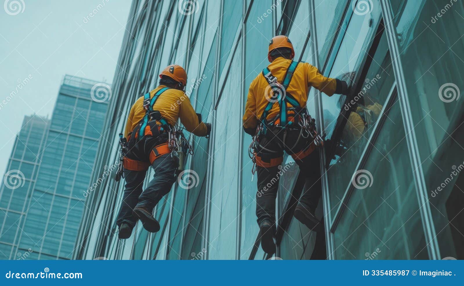 Two Window Washers Cleaning A Modern Building Facade Royalty-Free Stock ...