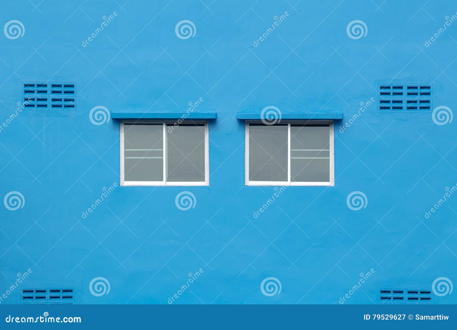 Two Windows on the Blue Wall. Stock Image - Image of glass, exterior ...