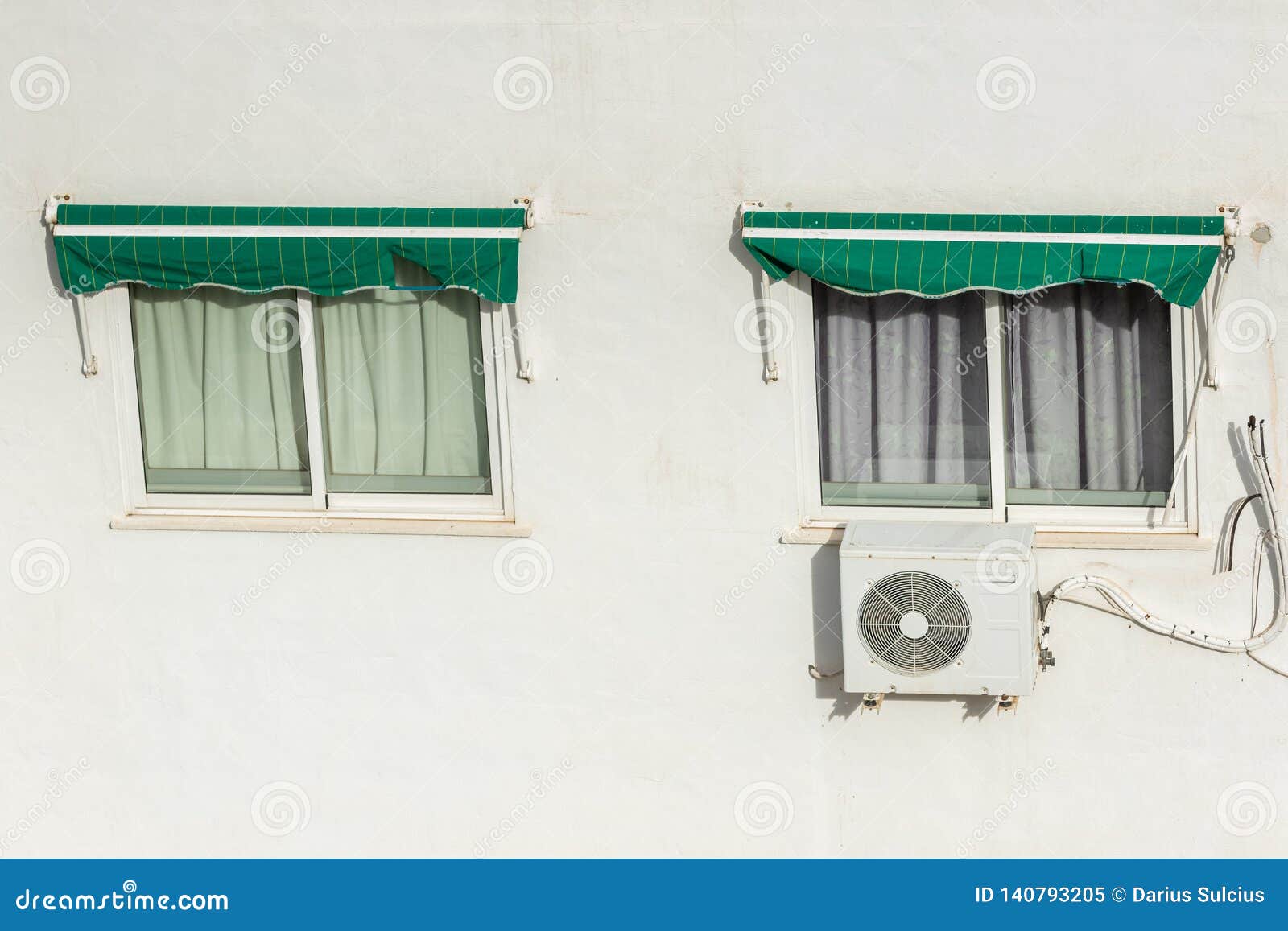 Two Windows Closed with Roller Shutters and Air Conditioning System ...