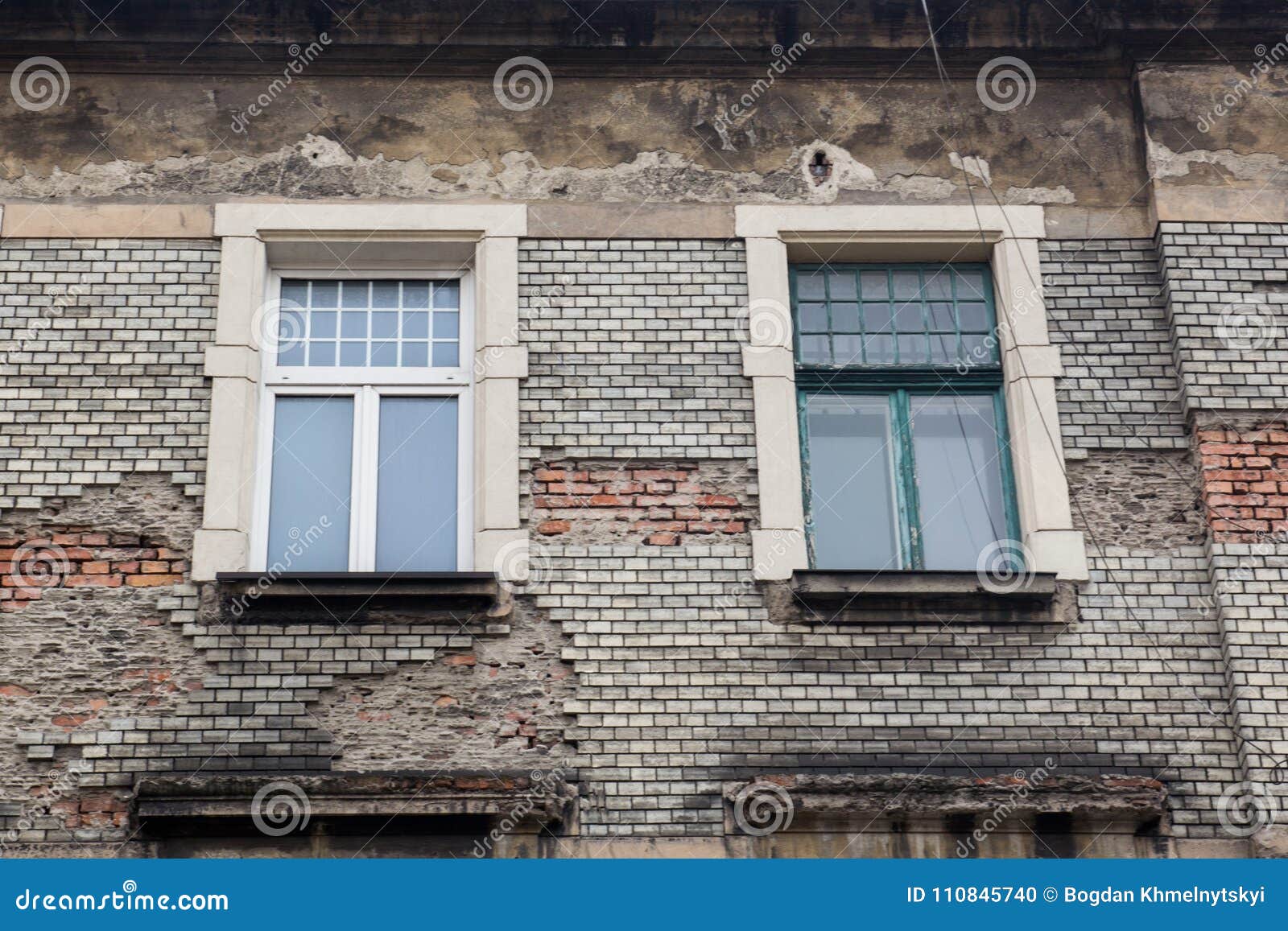 Two Windows on the Facade of the Old Damaged Brick Building Stock Photo ...