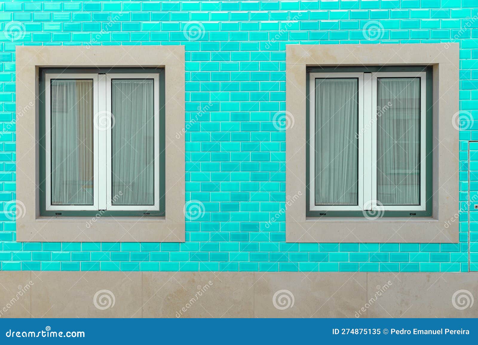 Two Windows on the Facade of a Residence with a Blue-green Tiled Wall ...