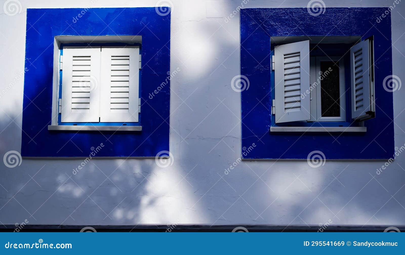 Two Windows in Whitewashed House Facade, Blue Border and White Shutters ...