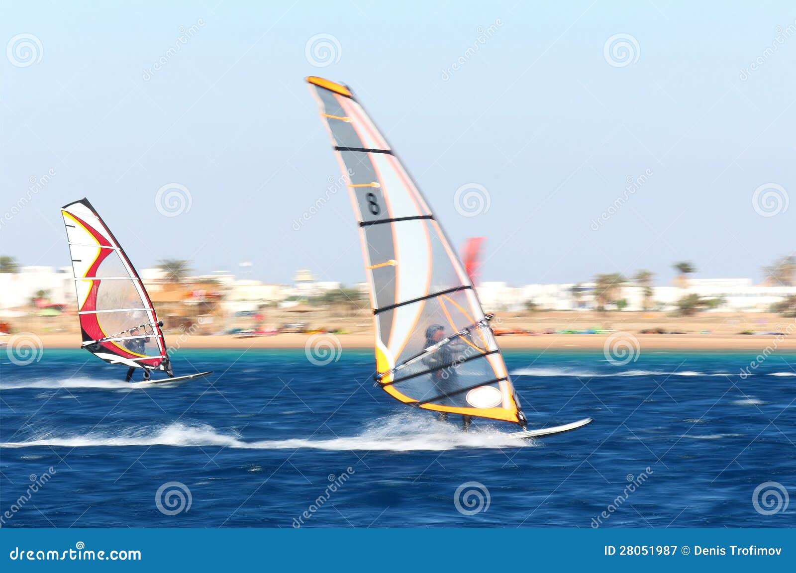 Two windsurfers in motion stock image. Image of surfer - 28051987