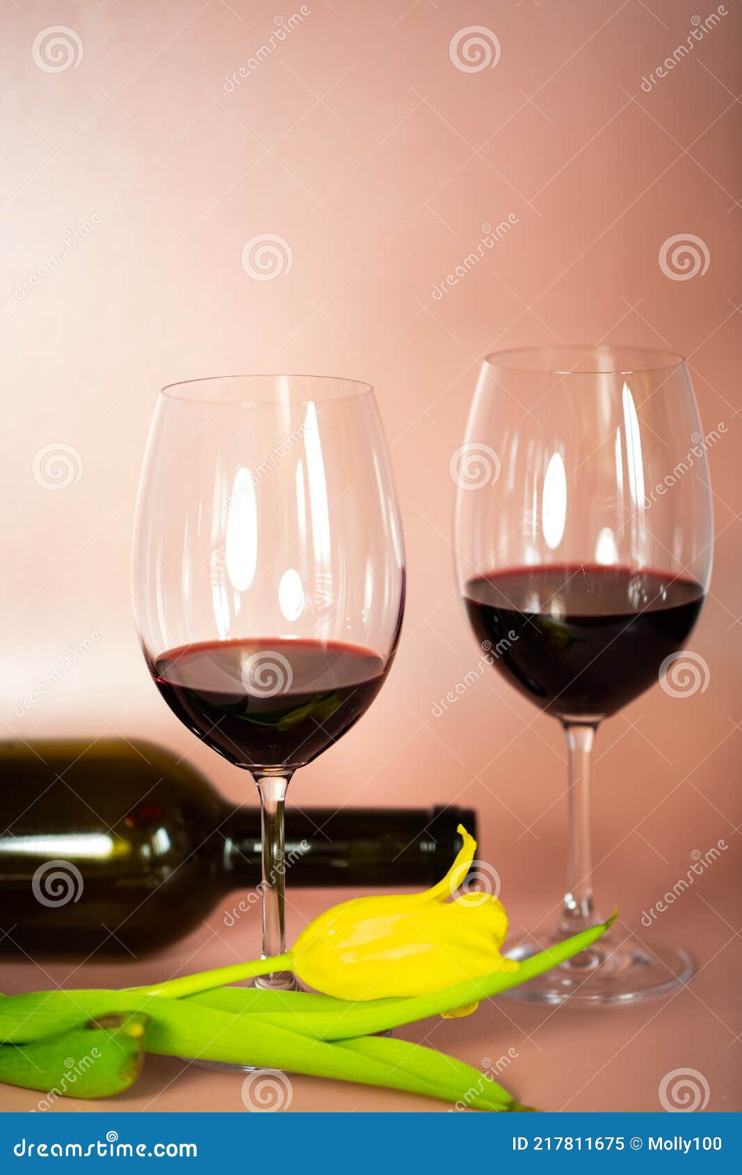 Two Wine Glasses with Wine Bottle, Pink Background Stock Image - Image ...