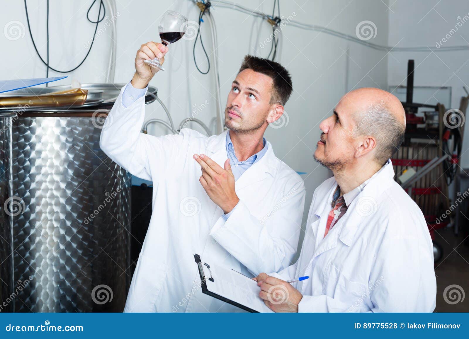 Two Winery Workers Standing with Glass of Wine Stock Photo - Image of ...