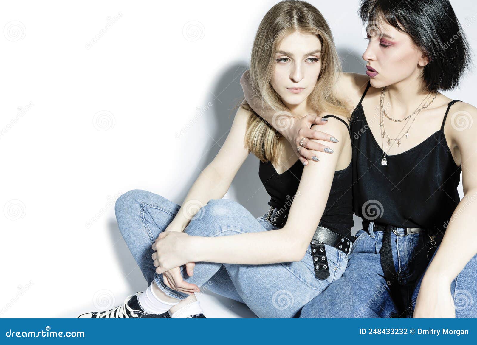 Two Winsome Lovely Relaxing Caucasian Lesbians Embracing With Hug