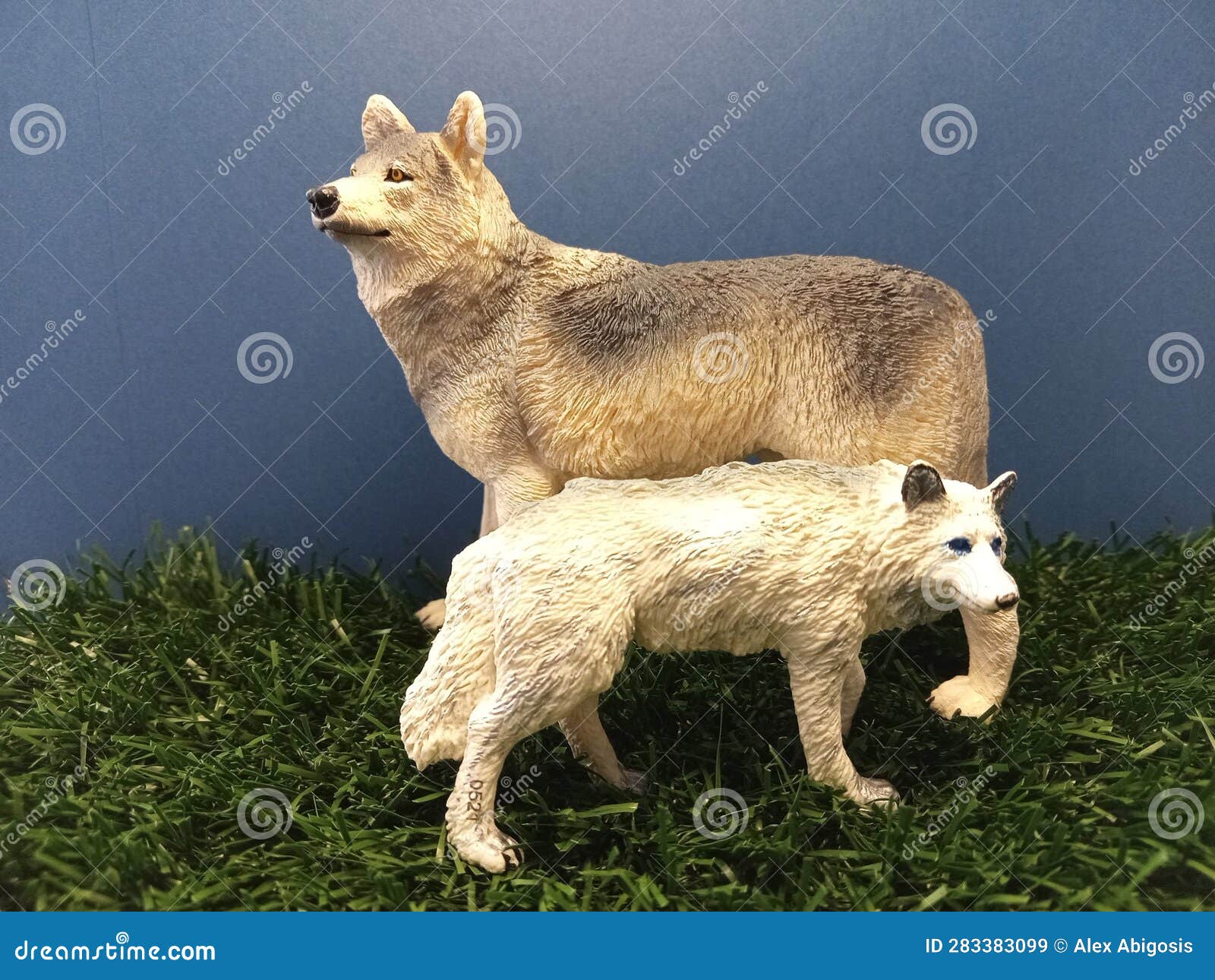 Two Wolf Toy Figures on Green Grass Stock Image - Image of abstract ...
