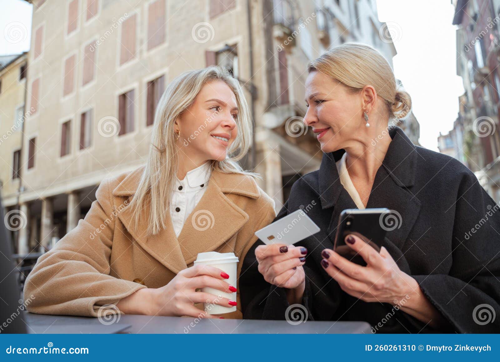 Two Woman Discussing How To Connect To Internet through Mobile Network ... Two Woman Discussing How To Connect To Internet through Mobile Network ...