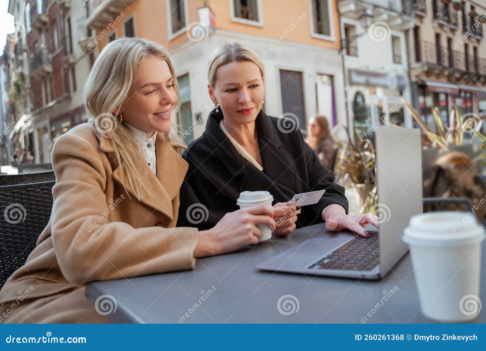 Two Woman Discussing How To Connect To Internet through Mobile Network ... Two Woman Discussing How To Connect To Internet through Mobile Network ...