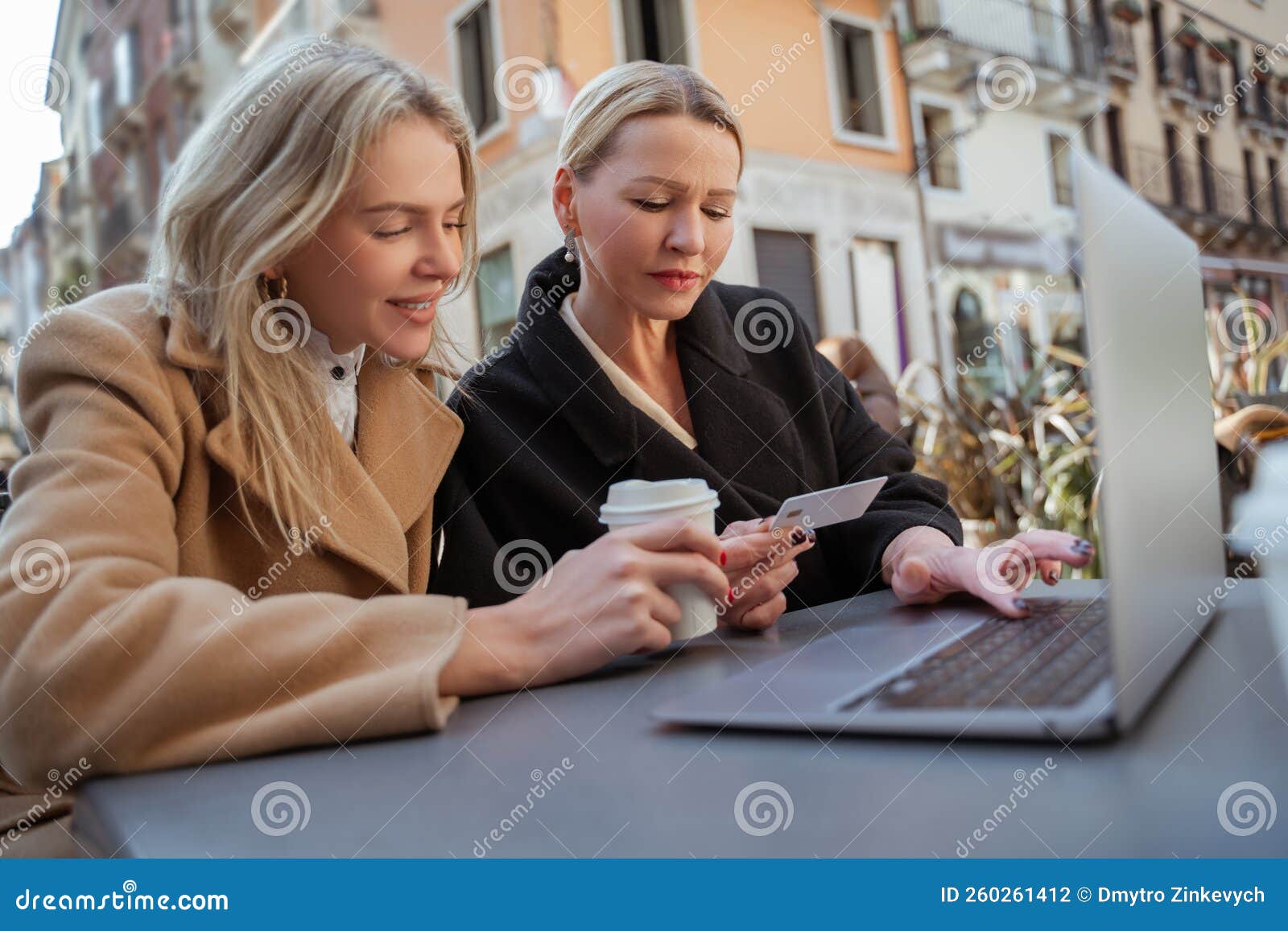Two Woman Discussing How To Connect To Internet through Mobile Network ... Two Woman Discussing How To Connect To Internet through Mobile Network ...