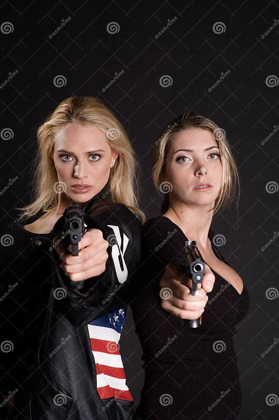 Two woman with guns stock image. Image of buxom, guns - 2068015