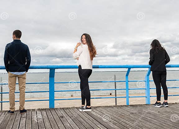 Two woman and one man stock photo. Image of standing - 200433570